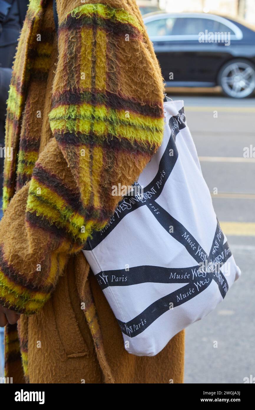 MILAN, ITALY - JANUARY 13, 2024: Woman with white Yves Saint Laurent ...