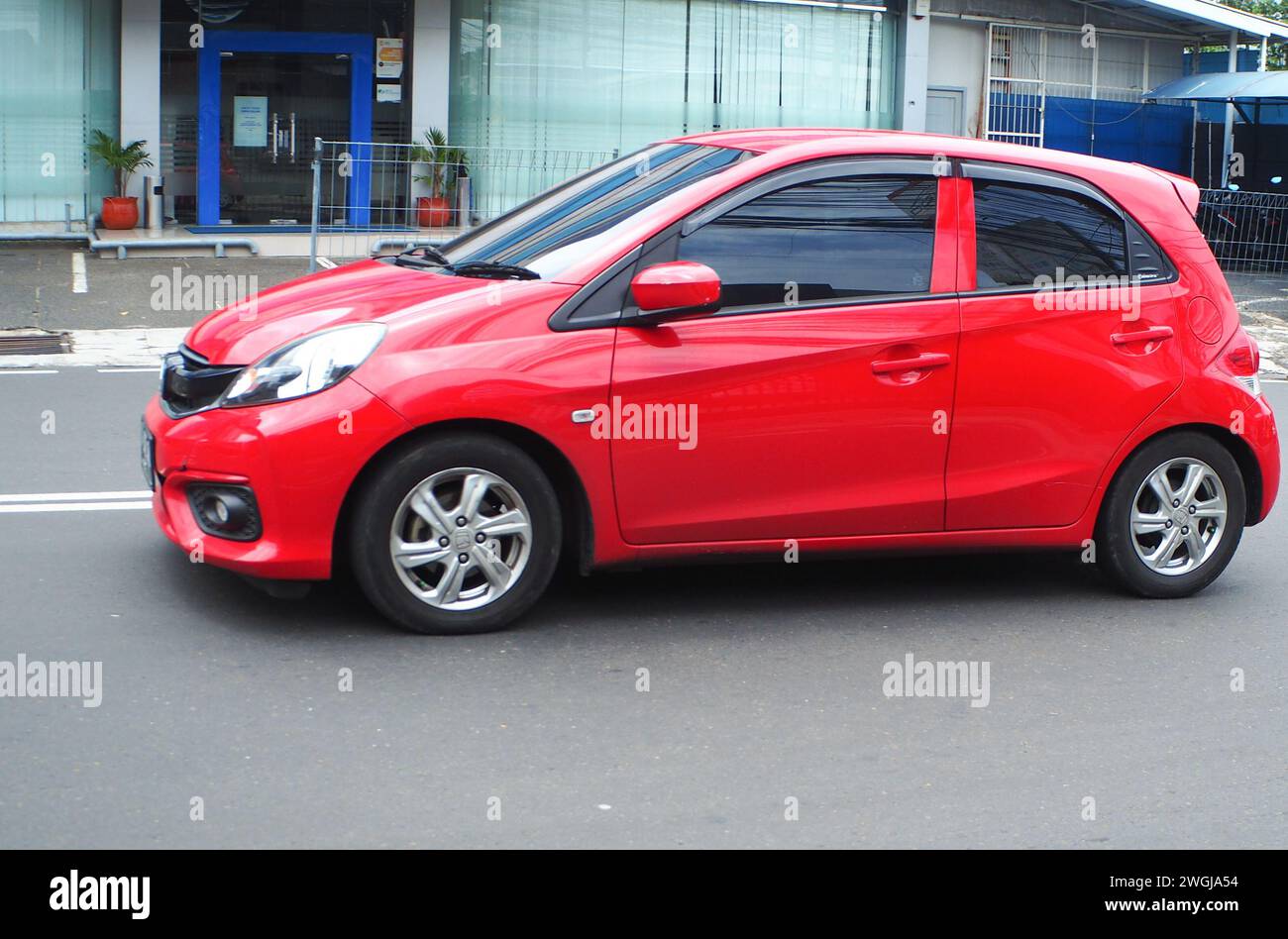 Honda Brio car, driving in commercial area, Radio Dalam Street, Jakarta ...