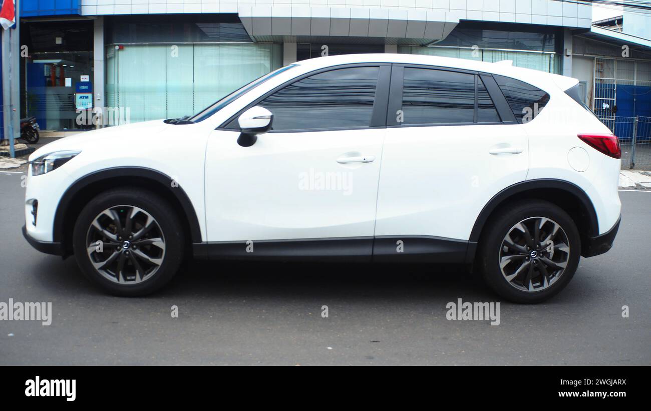 SUV Mazda CX-5 car, driving in commercial area, Radio Dalam Street ...