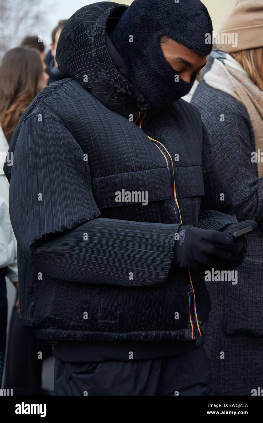 MILAN, ITALY - JANUARY 14, 2024: Man with K-way padded jacket and black ...