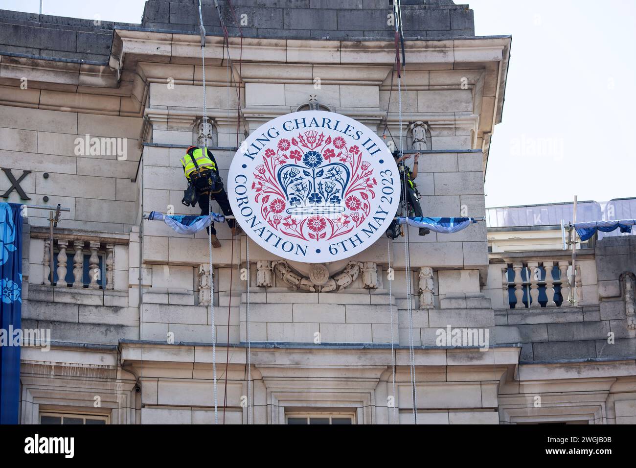 The coronation emblem of King Charles III is installed on the Admiralty ...