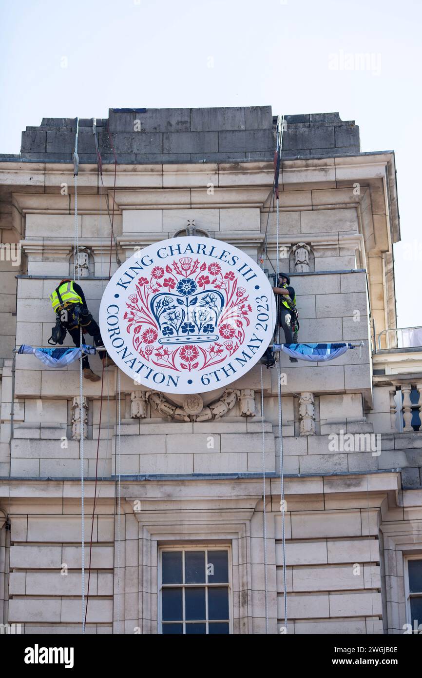 The coronation emblem of King Charles III is installed on the Admiralty ...