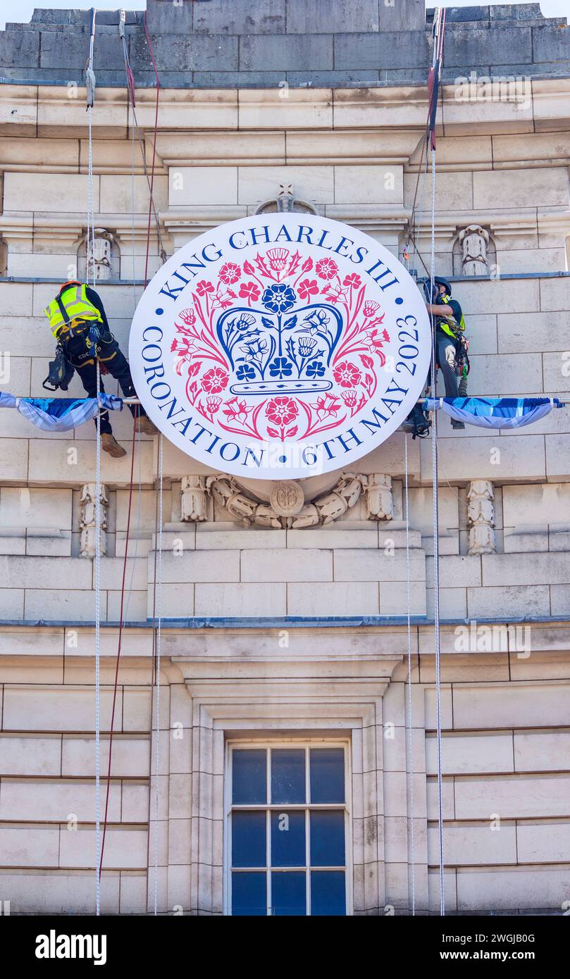 The coronation emblem of King Charles III is installed on the Admiralty ...