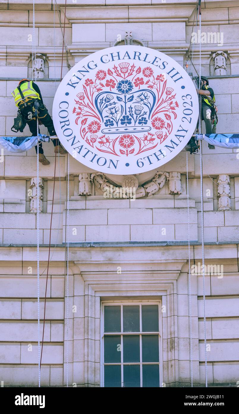 The coronation emblem of King Charles III is installed on the Admiralty ...