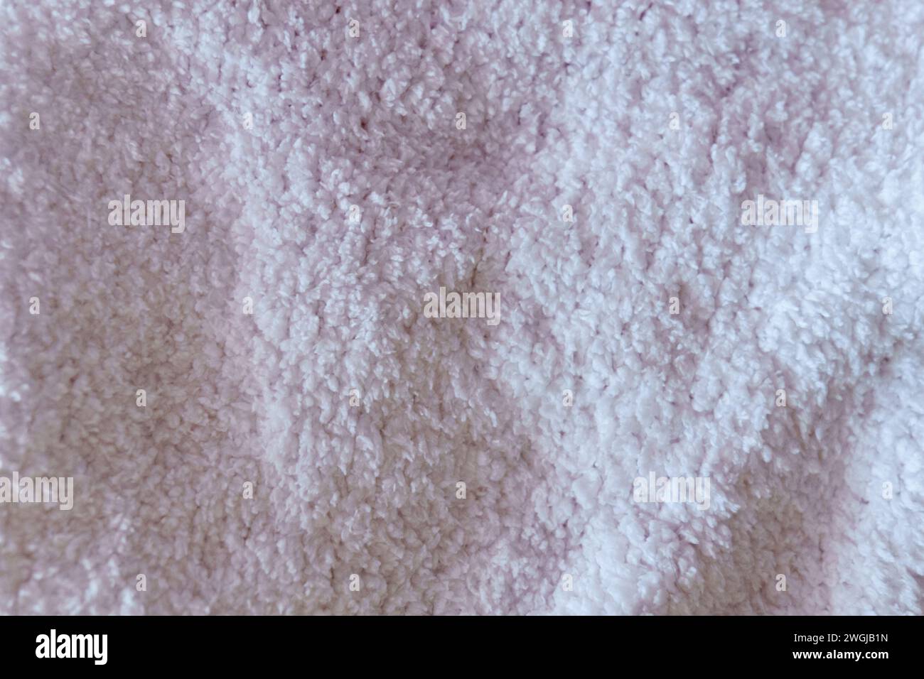 Delicate and cozy texture of a light-colored fabric, inviting a sense ...