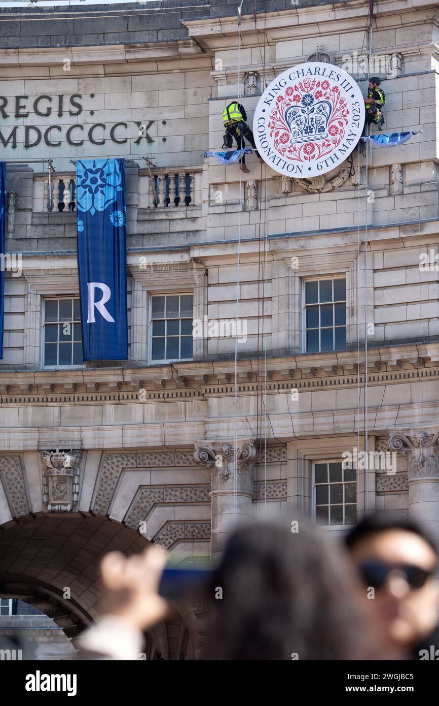 The coronation emblem of King Charles III is installed on the Admiralty ...