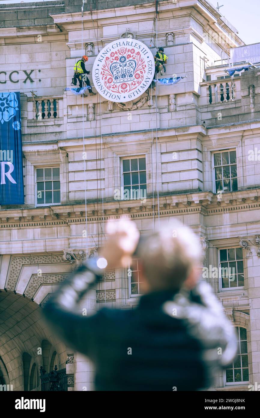 The coronation emblem of King Charles III is installed on the Admiralty ...