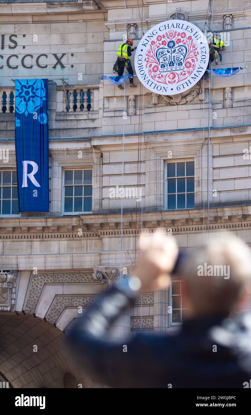 The coronation emblem of King Charles III is installed on the Admiralty ...