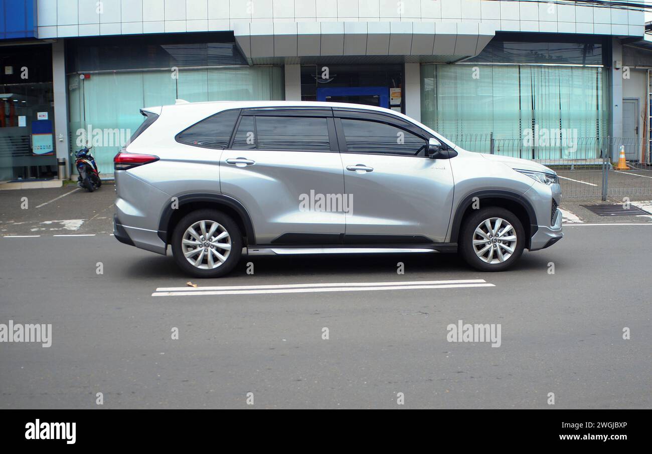 MPV Toyota Kijang Innova Zenix car, driving in commercial area, Radio ...
