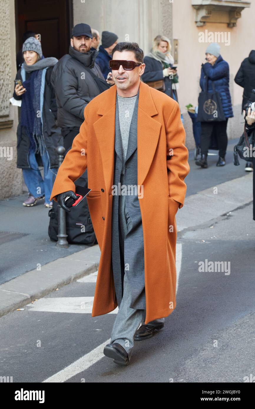 MILAN, ITALY - JANUARY 15, 2024: Alex Badia with orange coat and grey ...