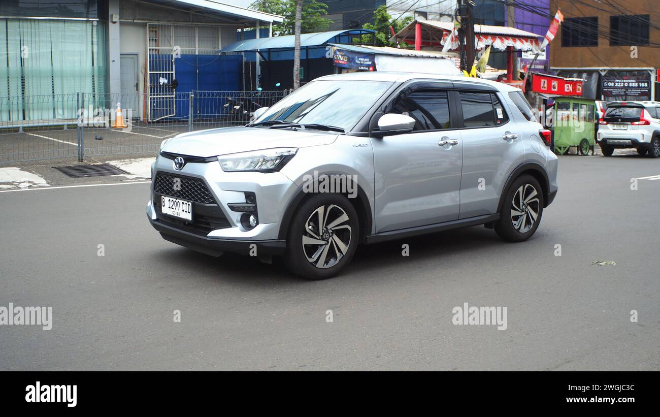 White Toyota Raize car, driving in commercial area, Radio Dalam Street ...