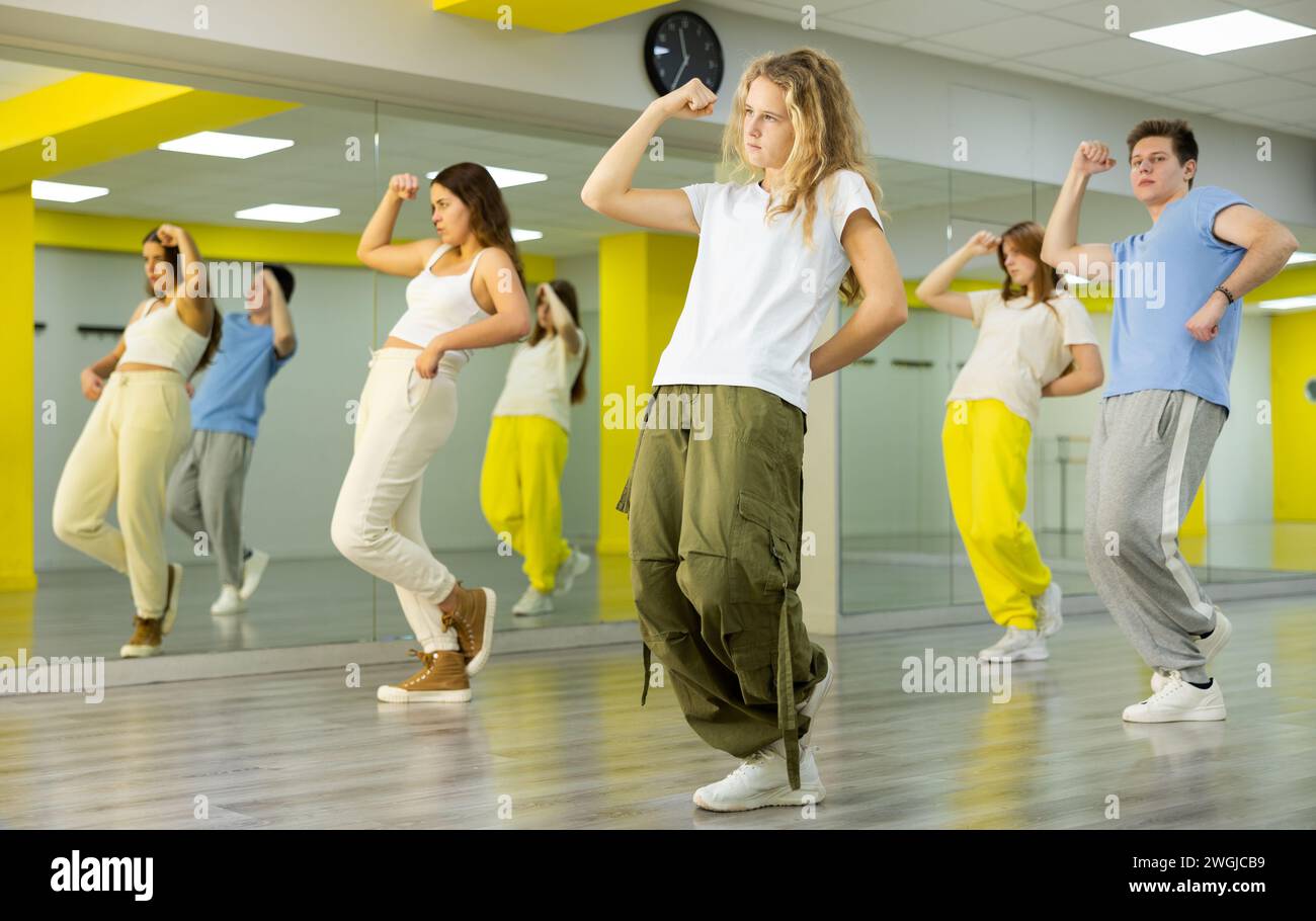 Teenage girl training breakdance Toprock moves in dance hall Stock ...