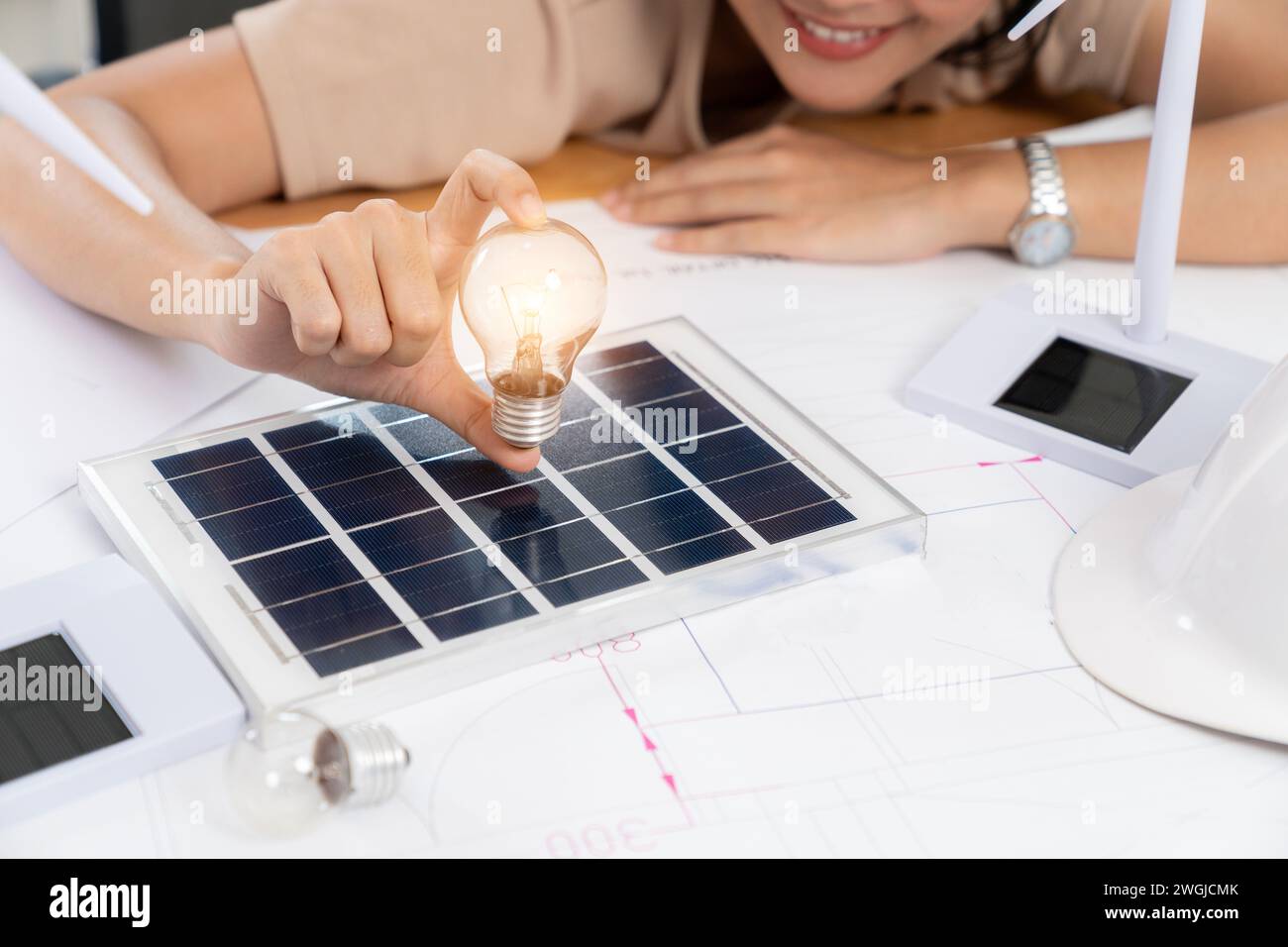 Light bulb powered by solar energy from solar cells Stock Photo - Alamy
