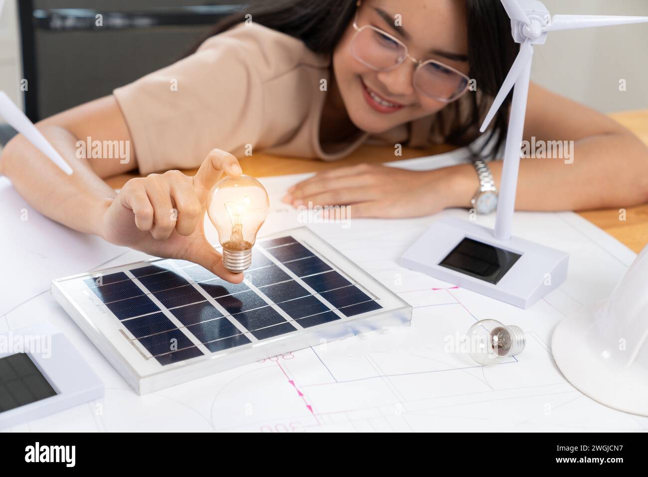 Light bulb powered by solar energy from solar cells Stock Photo - Alamy