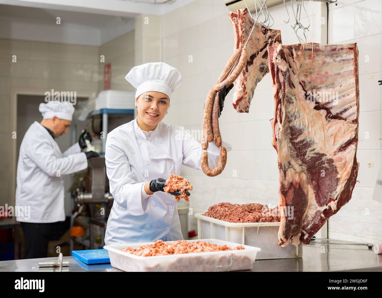 Butcher uniform cutting ribs hi-res stock photography and images - Alamy