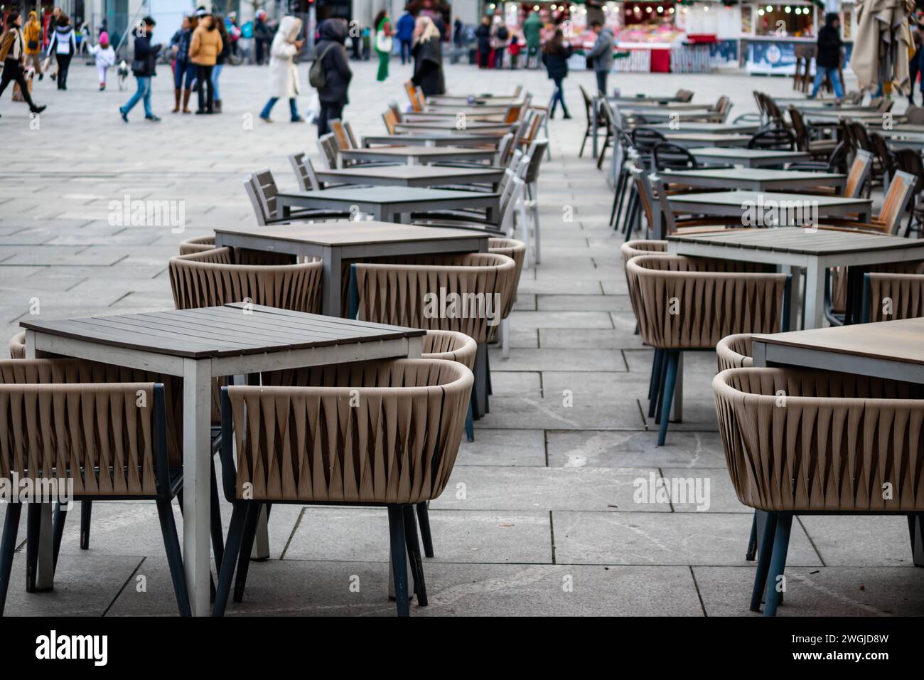 Empty chairs in coffee bar, outdoor seating but empty due to economic ...