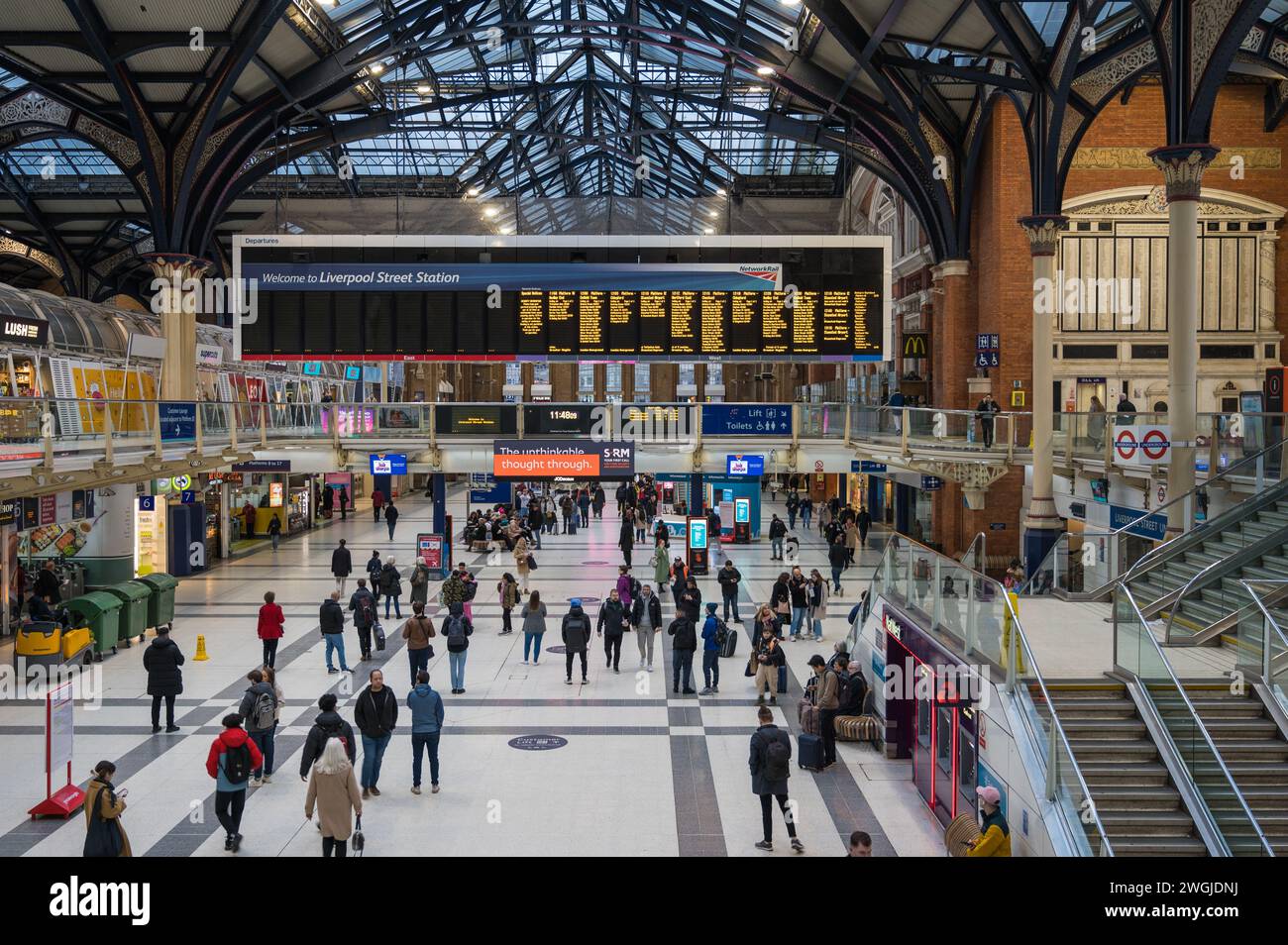 Travellers coming and going through Liverpool Street Station main ...