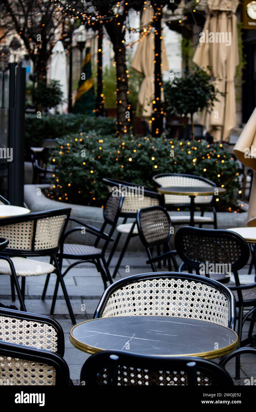 Empty chairs in coffee bar, outdoor seating but empty due to economic ...