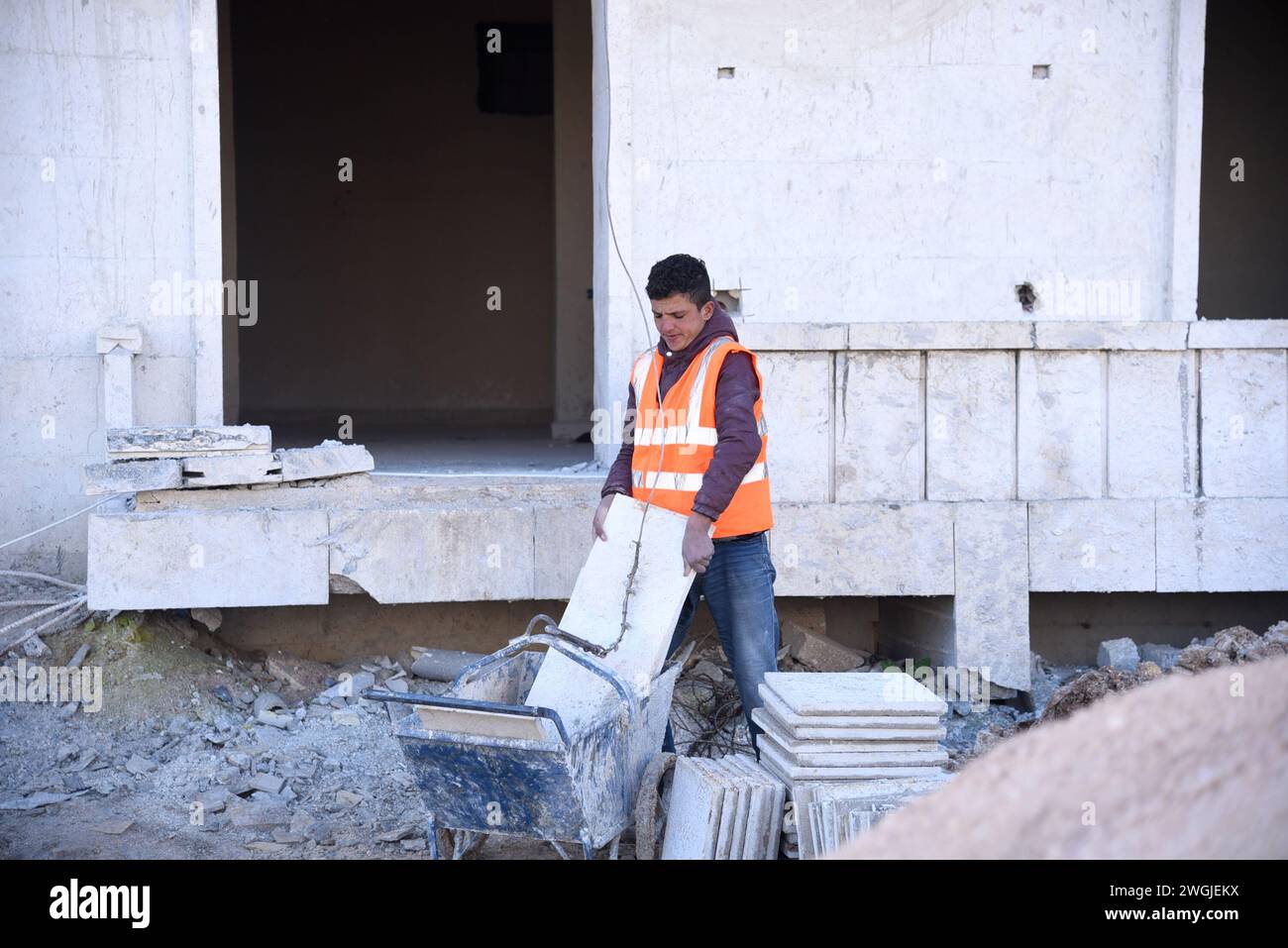 Aleppo, Syria. 24th Jan, 2024. A worker is seen at the construction ...