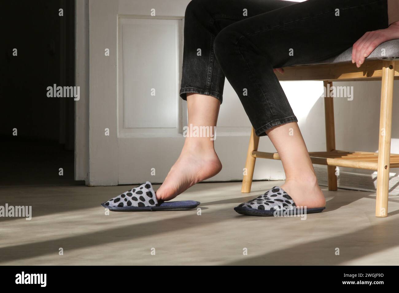 Woman wearing slippers hi-res stock photography and images - Alamy