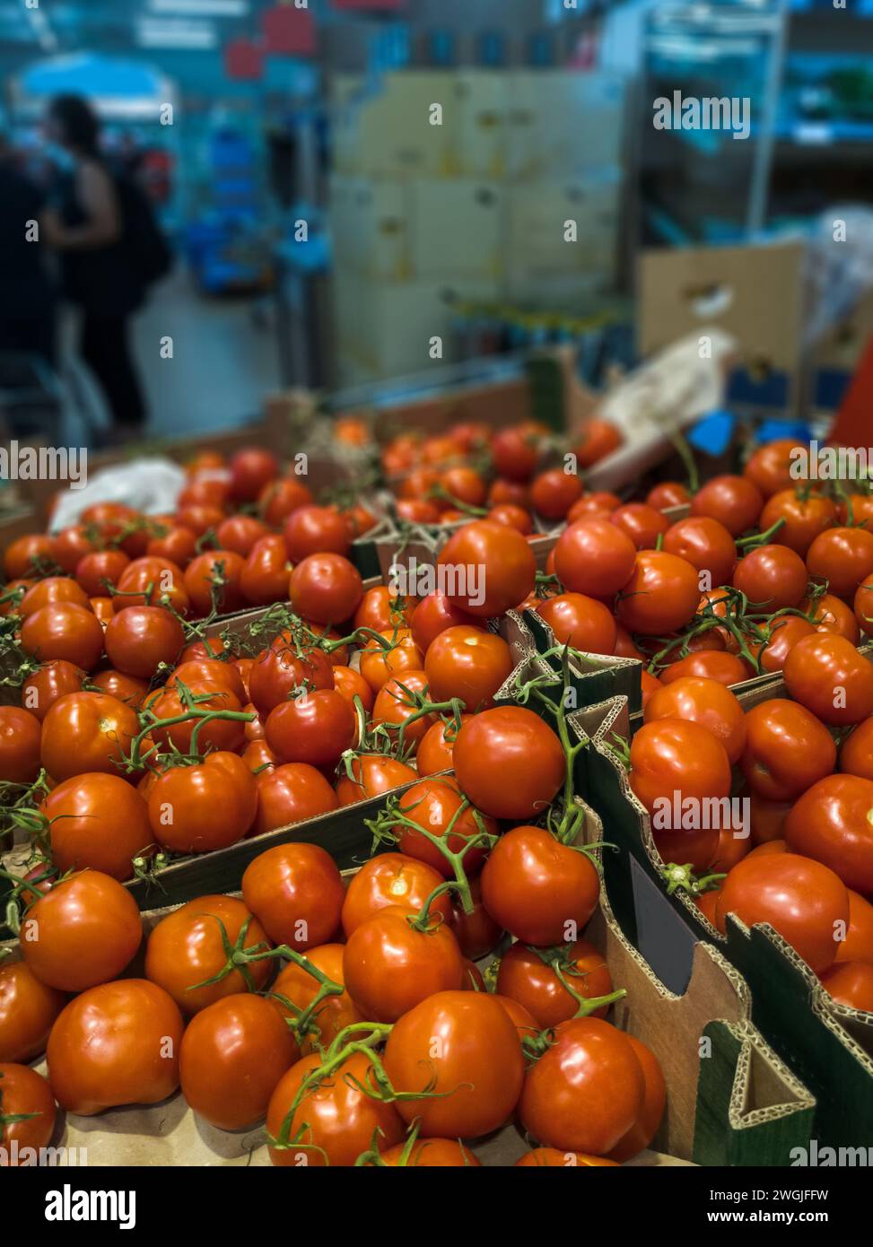 tomatoes displayed inside a supermarket Stock Photo - Alamy