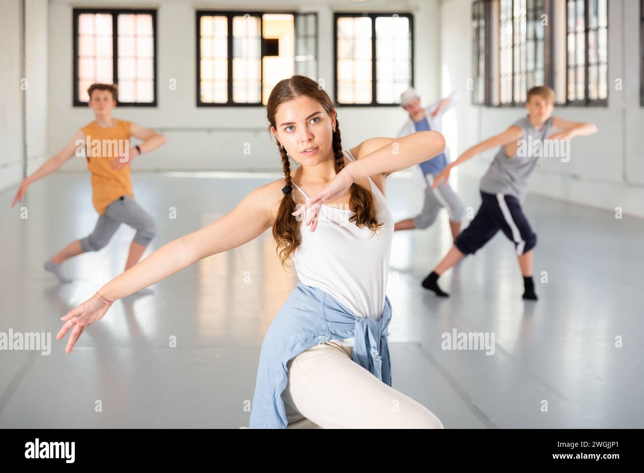 Group of young artists performing street dance Stock Photo - Alamy