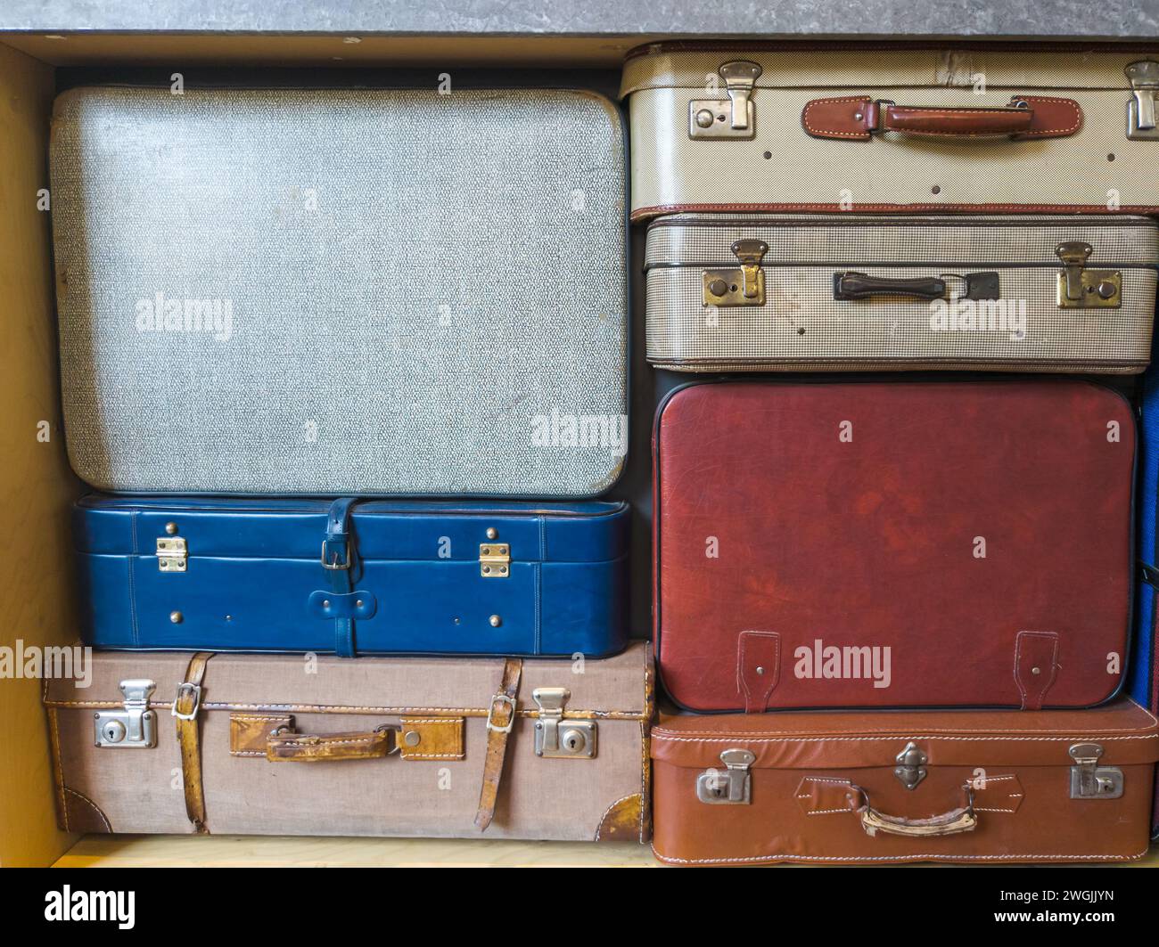 vintage suitcases stacked on top each other Stock Photo - Alamy