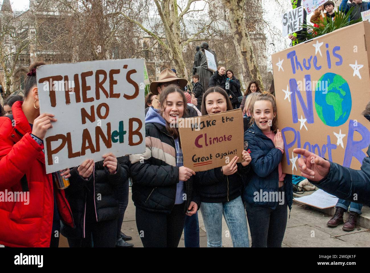 London UK. FridaysforFuture Protest. Smiling students with placards ...
