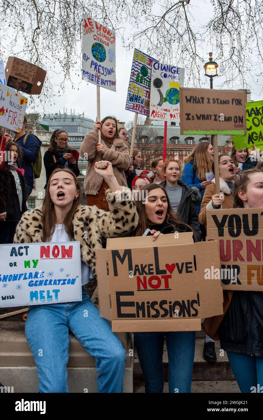 London UK. FridaysforFuture Protest. Girl students with many placards ...