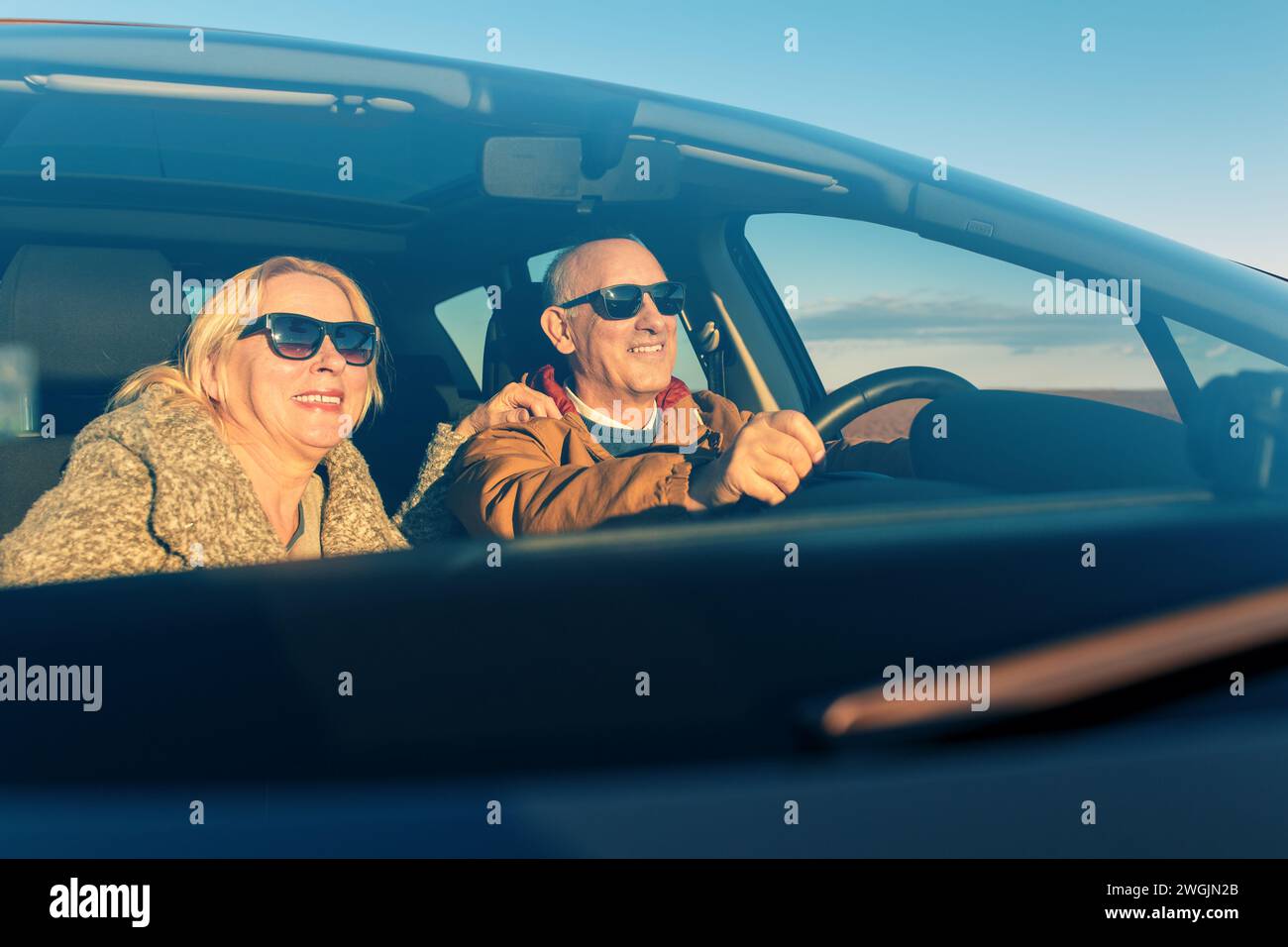 Elderly man driving car hi-res stock photography and images - Alamy
