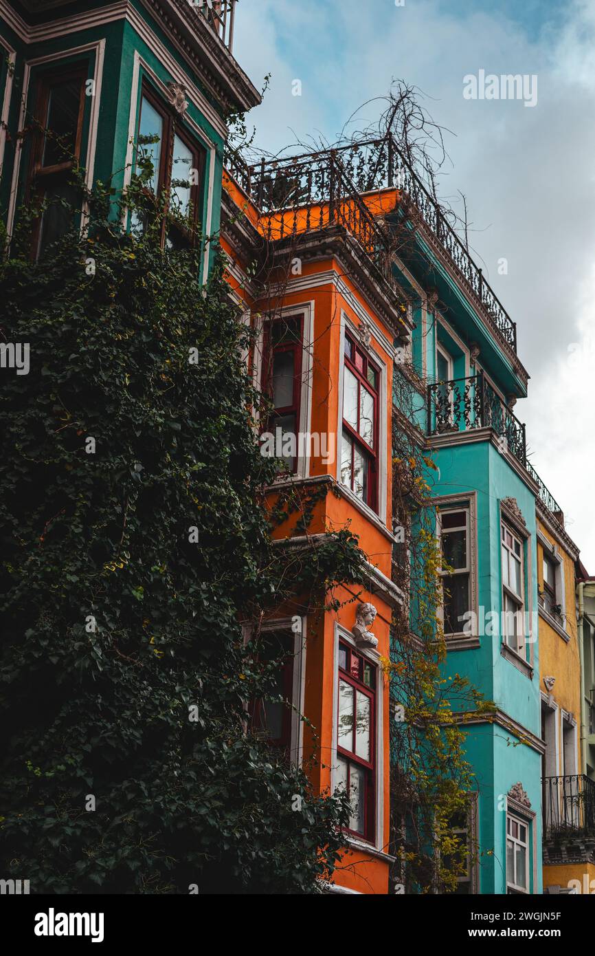Multi-colored building facades under a cloudy sky in Istanbul, Turkey ...