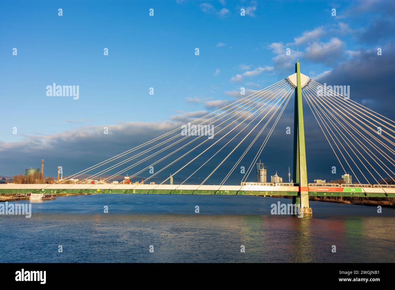 Vienna: bridge Donaustadtbrücke, river Donau (Danube), subway train U2 ...