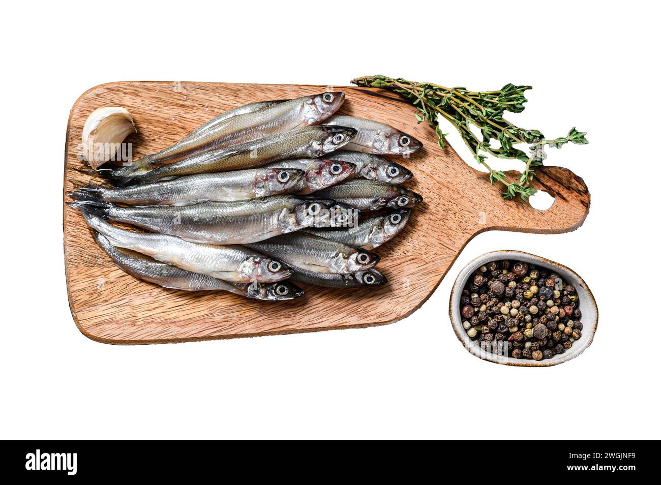 Fresh raw sea small fish smelt. Isolated on white background. Top view ...