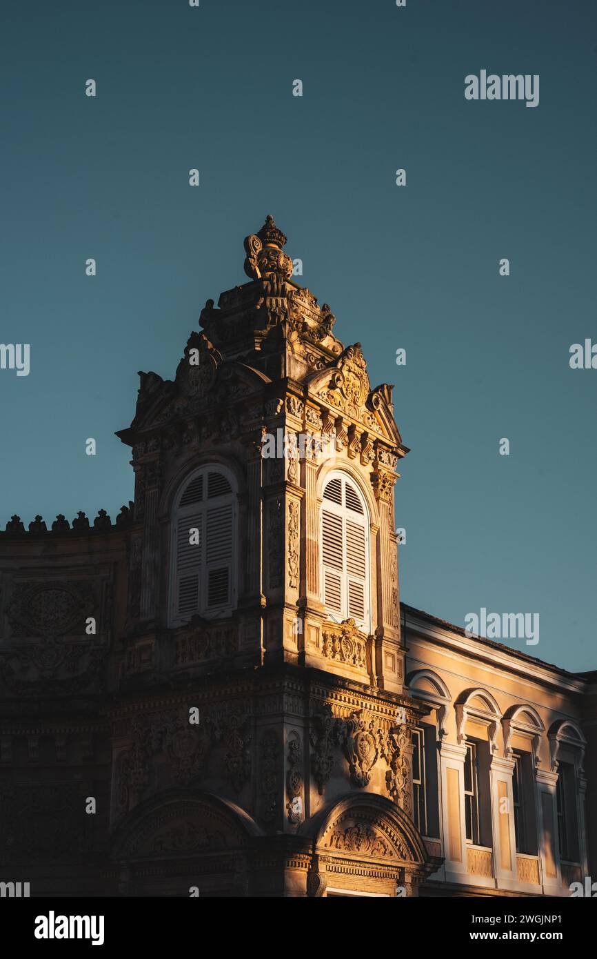 Towering skyscraper adorned with numerous windows, crowned by an ...