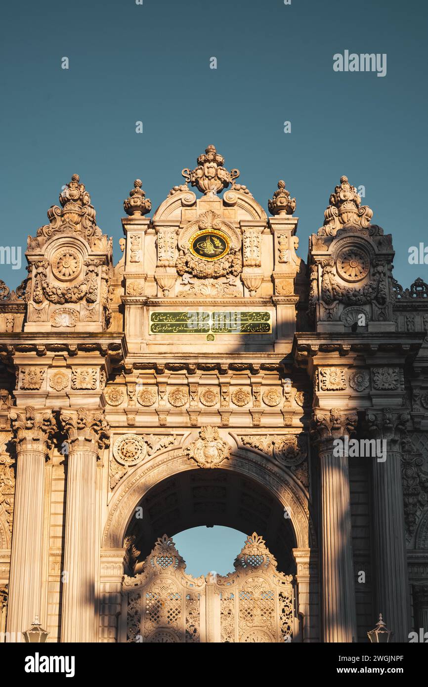 An ornate stone building with a clock atop its gate in Istanbul, Turkey ...