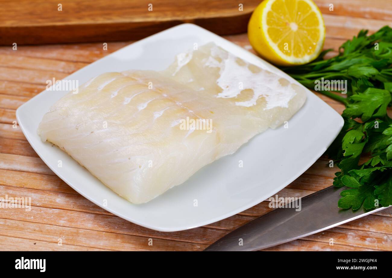 Raw pink cusk-eel fish fillet, seafood ingredients Stock Photo - Alamy