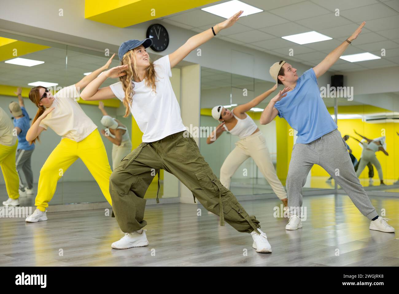 Teen girl in cap dancing modern dances Stock Photo - Alamy