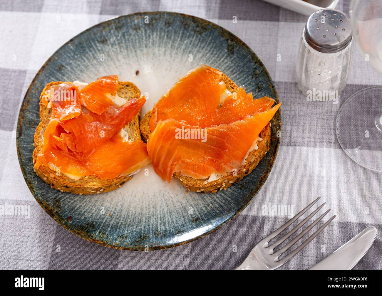 canapes with delicate butter and pieces of bright pink salmon Stock ...