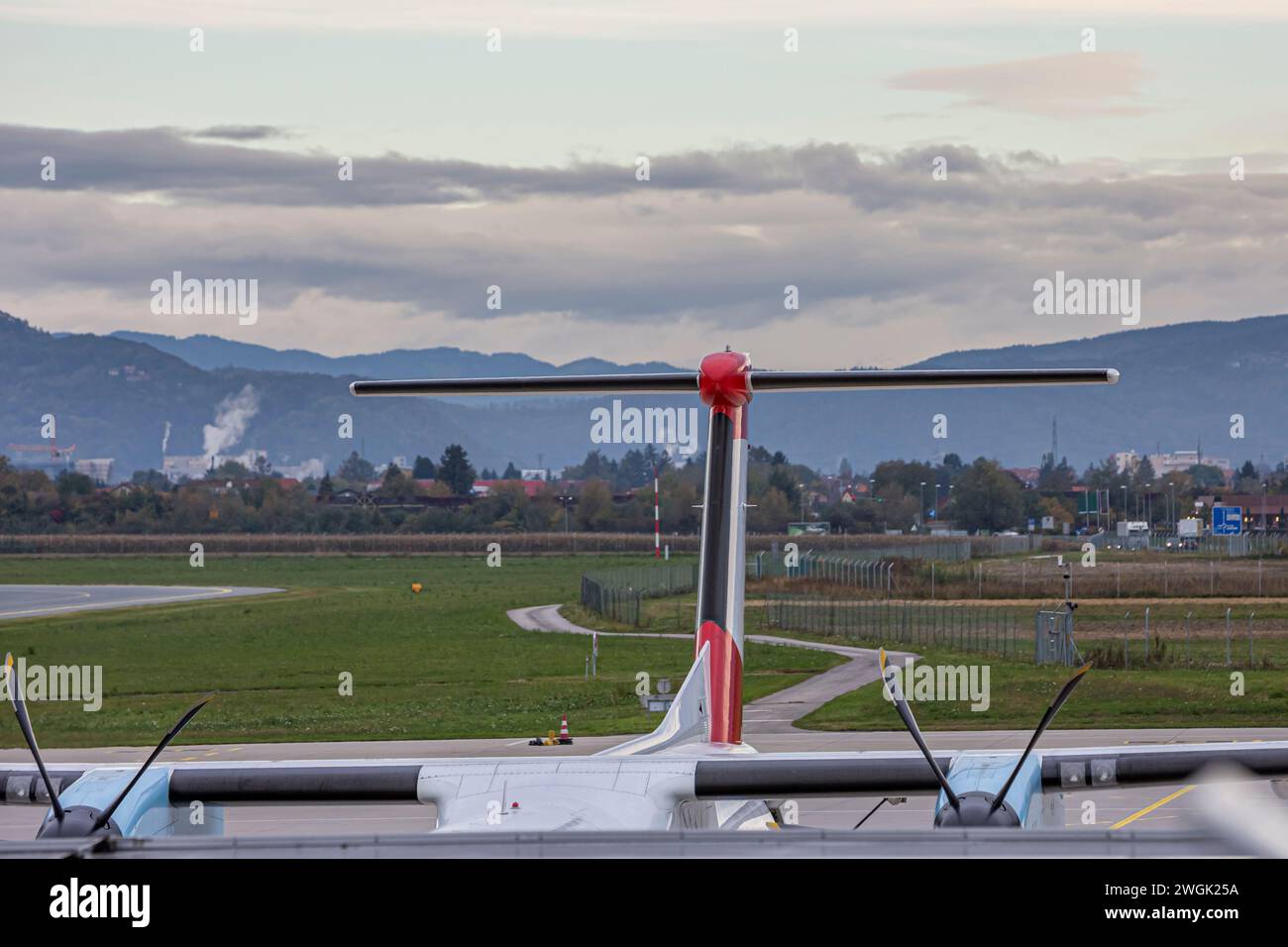 Airplane tail of a plane and propellers close up against the background ...