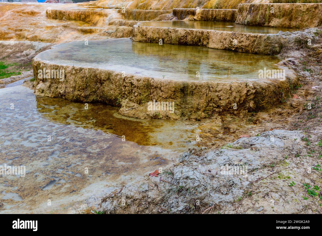 Travertine terraces with hot water of Karahyit Red Springs, Turkey ...