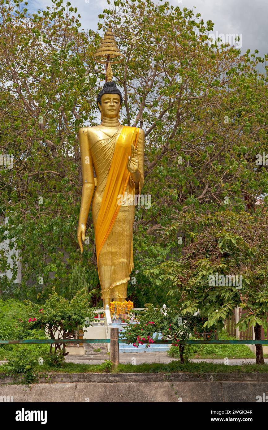 Golden statue of the Standing Buddha few meters from Wat Paknam in Hat ...