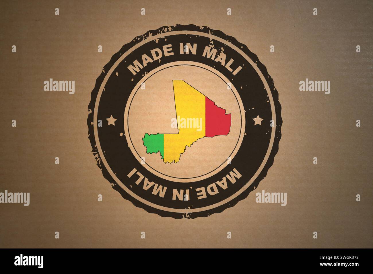 Brown paper with in its middle a retro style stamp Made in Mali include ...
