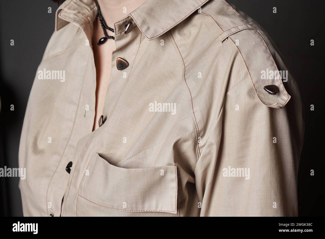 Women's plain beige shirt with a pocket on the chest, triangular ...