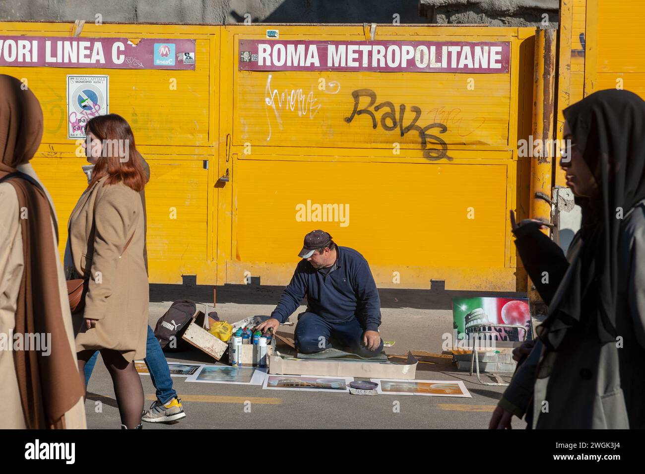 February 04, 2024 - Rome, Italy: Tourists and a street artist in Via ...