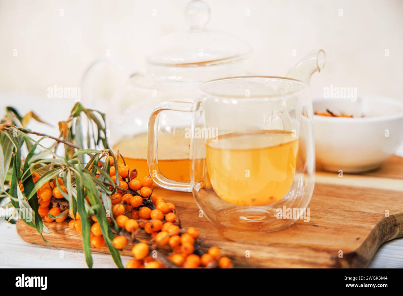 Clear teapot with sea buckthorn tea, a medley of flavors and health ...
