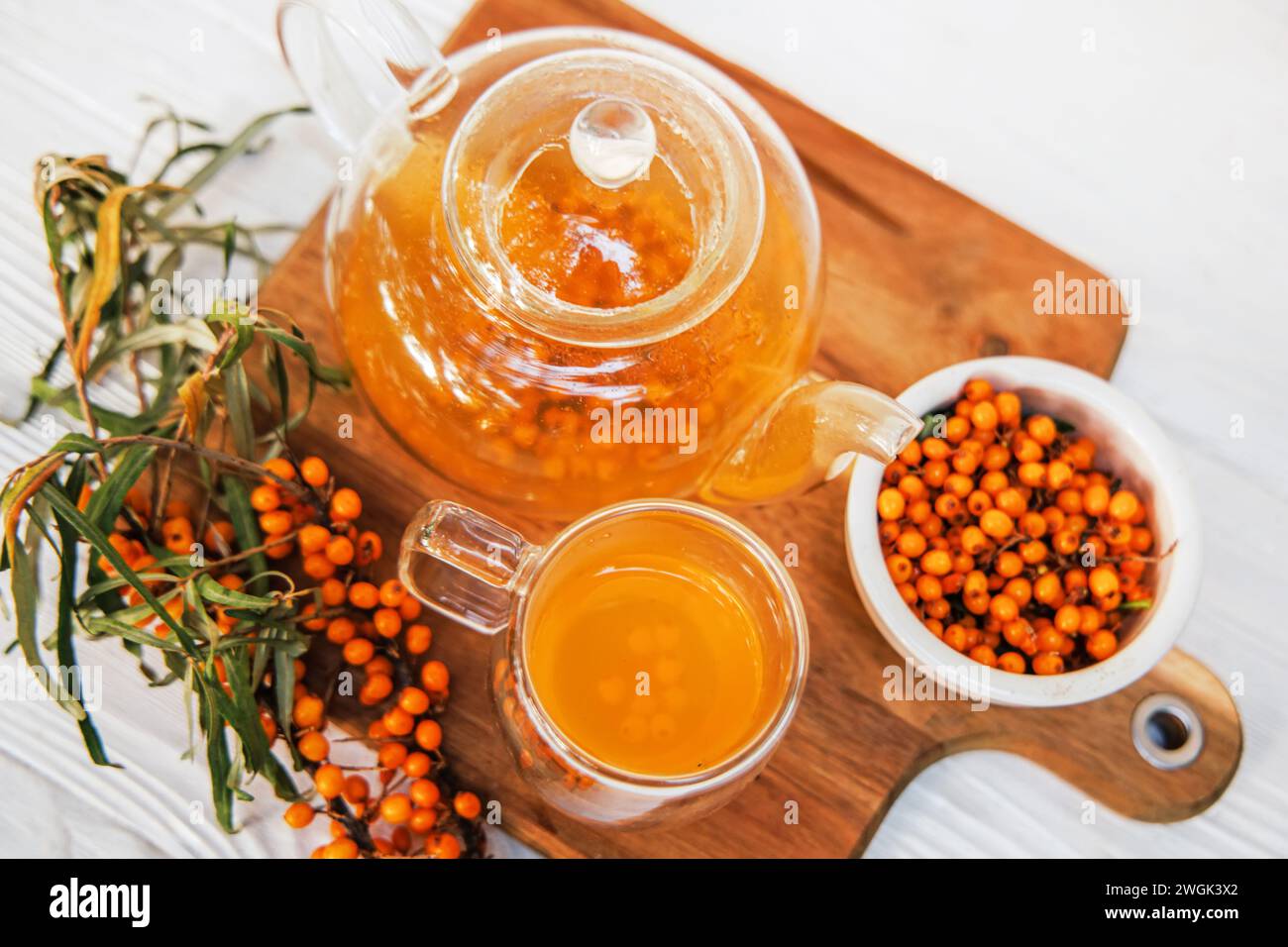Clear teapot with sea buckthorn tea, a medley of flavors and health ...