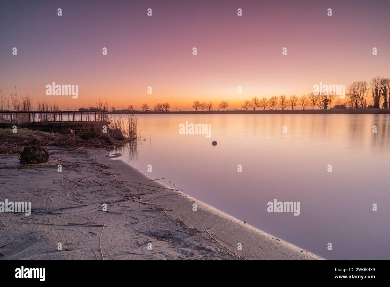 Surf beach with a jetty at Oude Veer in Anna Paulowna during a colorful ...