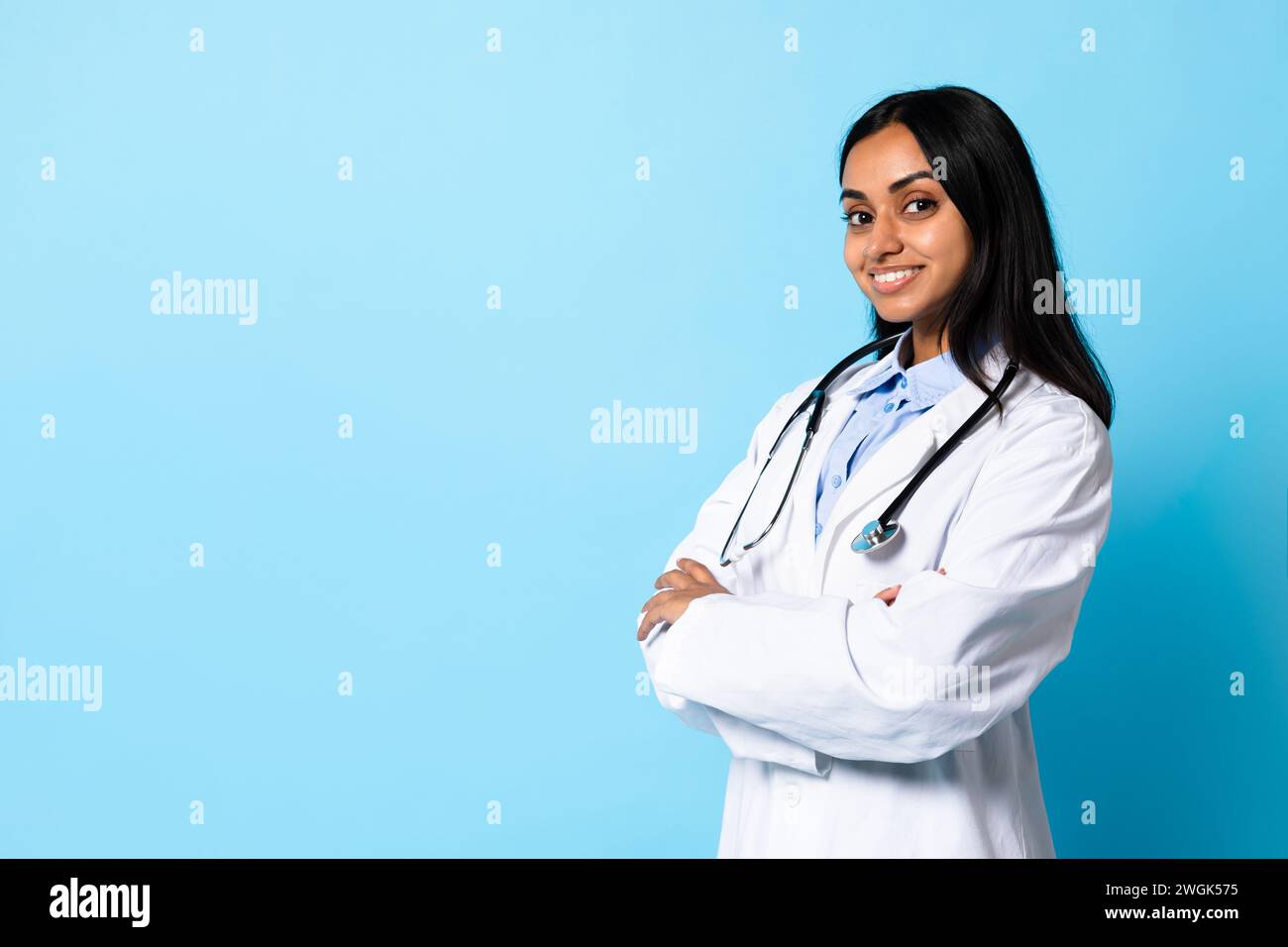 hindu doctor lady wearing medical white coat and stethoscope, studio ...
