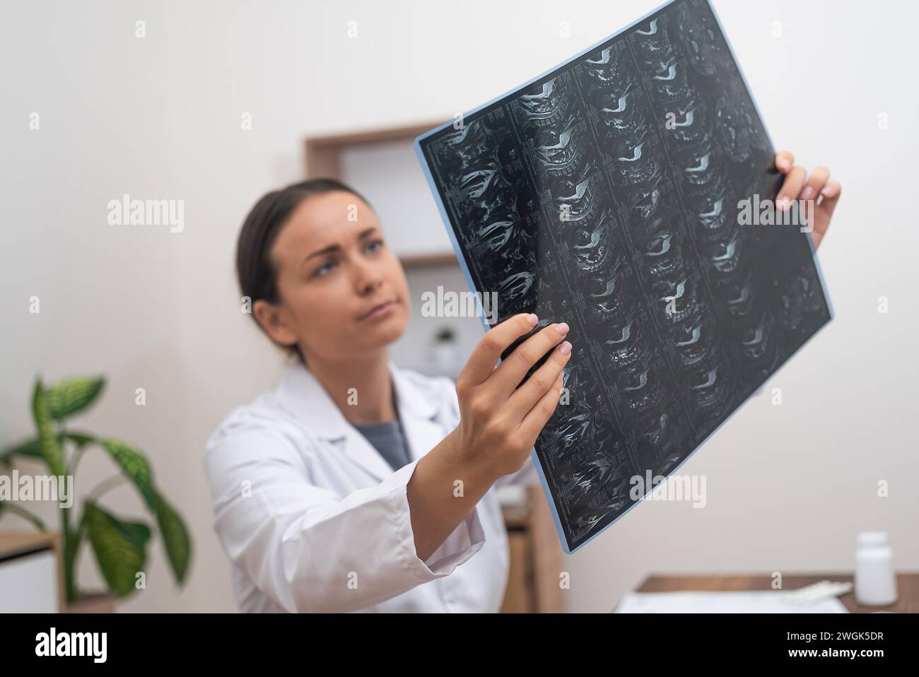 Orthopedic Diagnosis: doctor uses a laptop to assess patient X-ray ...