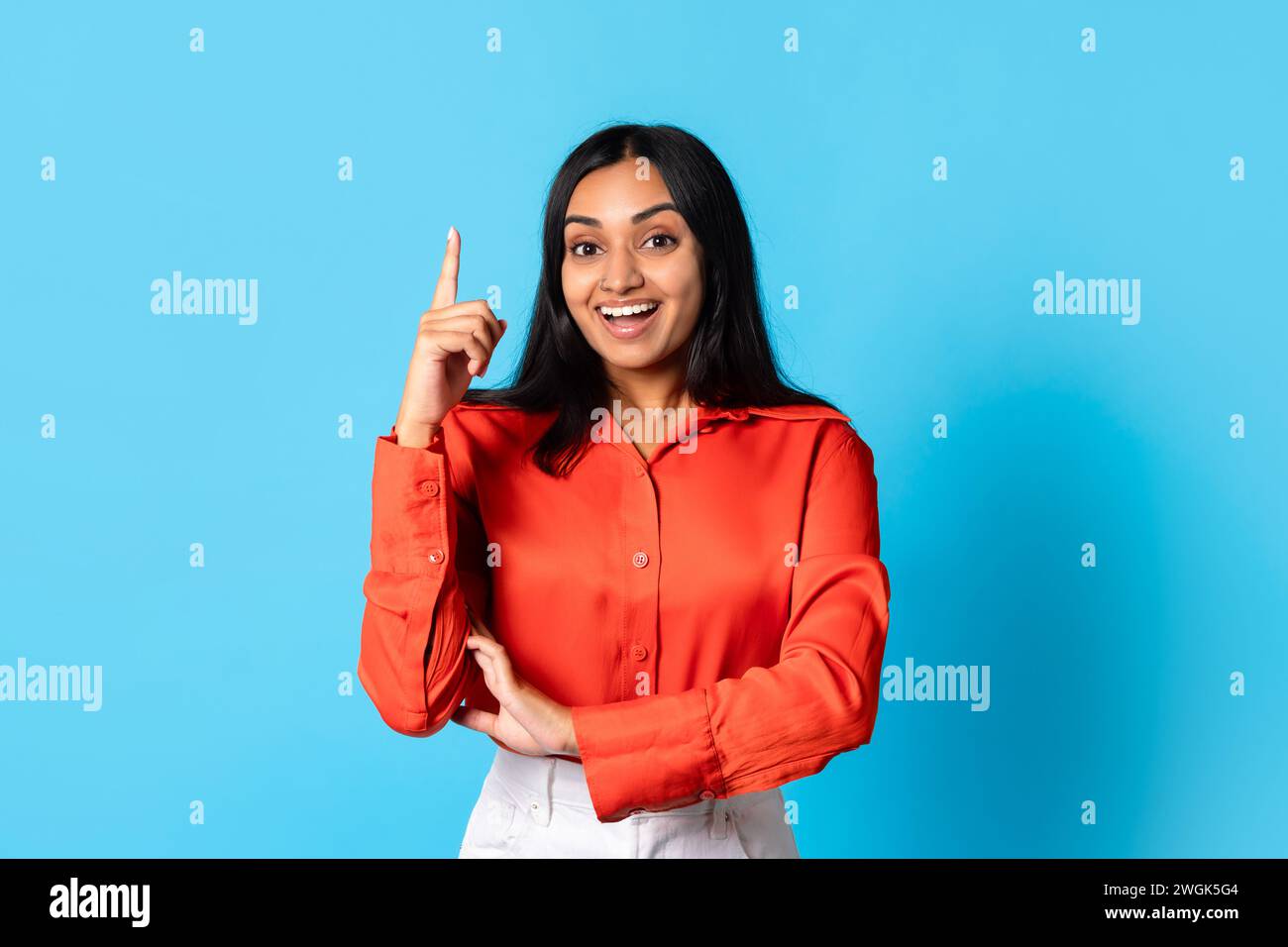 Happy millennial lady points hi-res stock photography and images - Alamy
